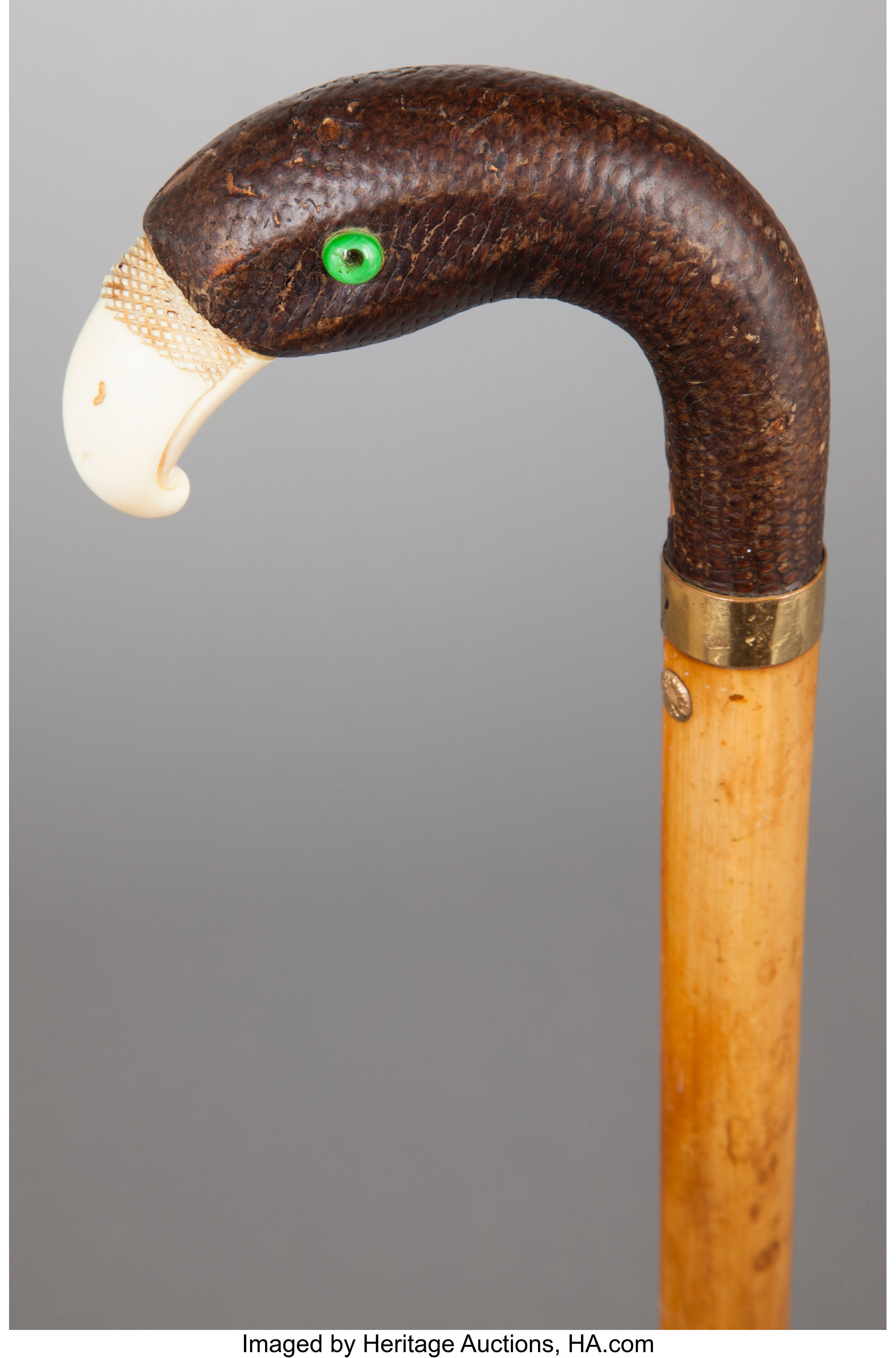 AN IVORY, LEATHER AND WOOD PARROT CANE . Henry Howell Co., London ...