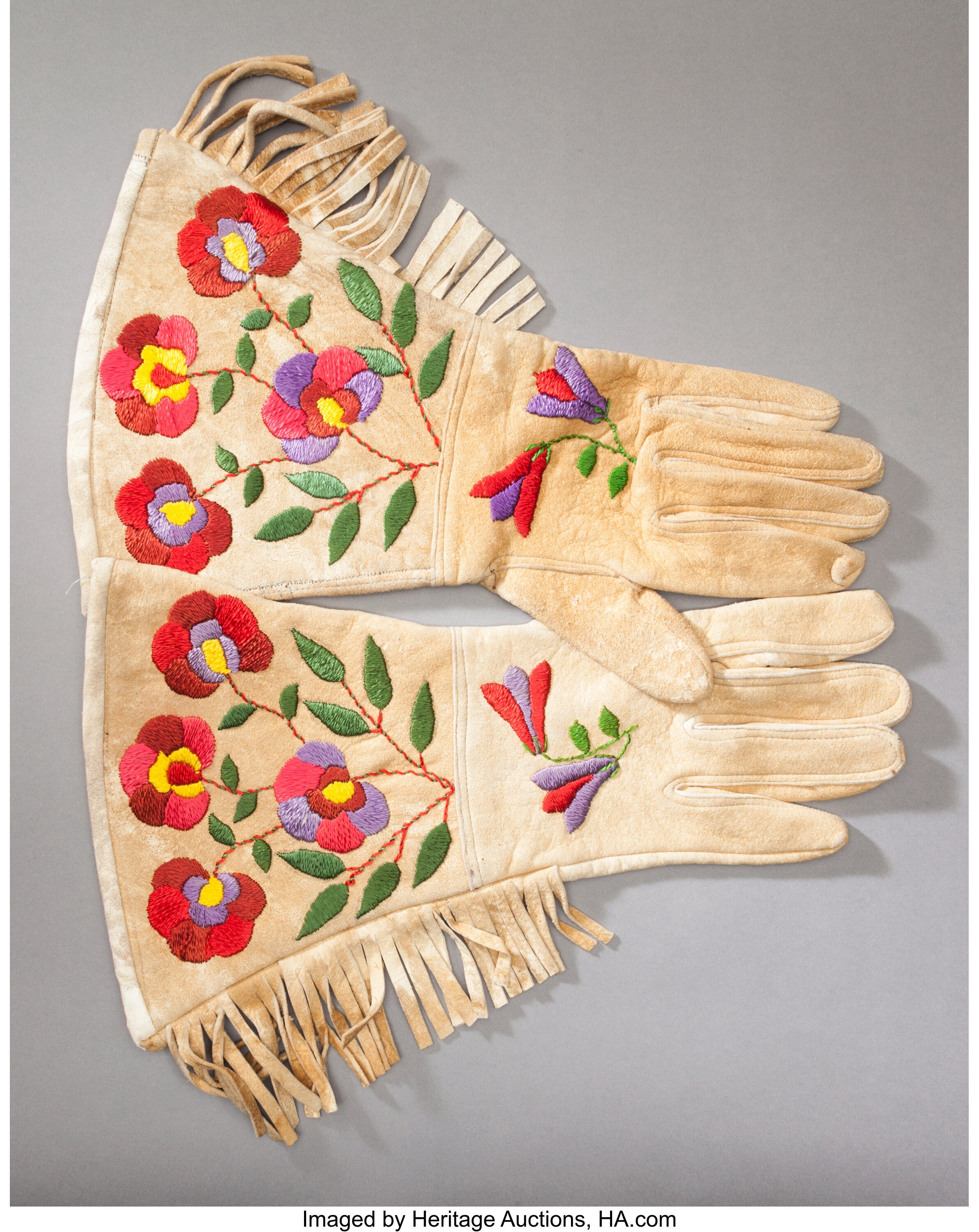 A PAIR OF PLATEAU EMBROIDERED HIDE GAUNTLETS. c. 1910... (Total: 2 ...
