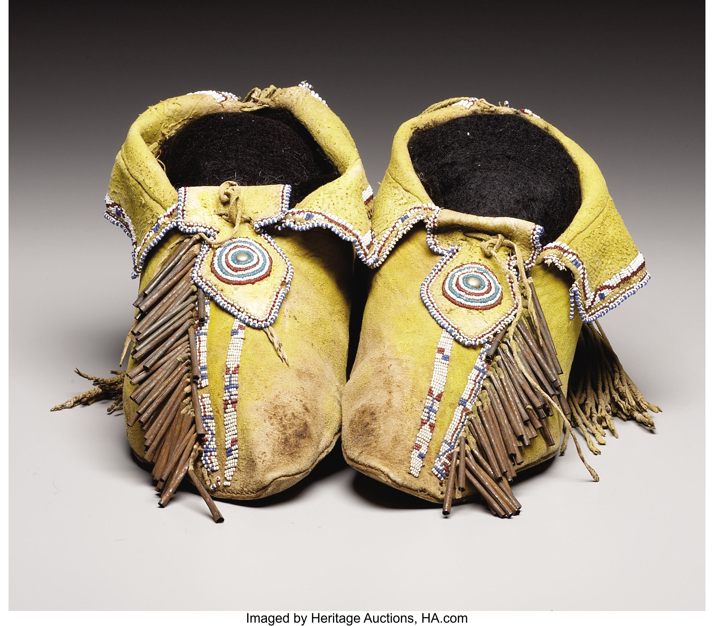 A PAIR OF COMANCHE BEADED HIDE MOCCASINS. . c.1880. ... (Total: 2 | Lot ...