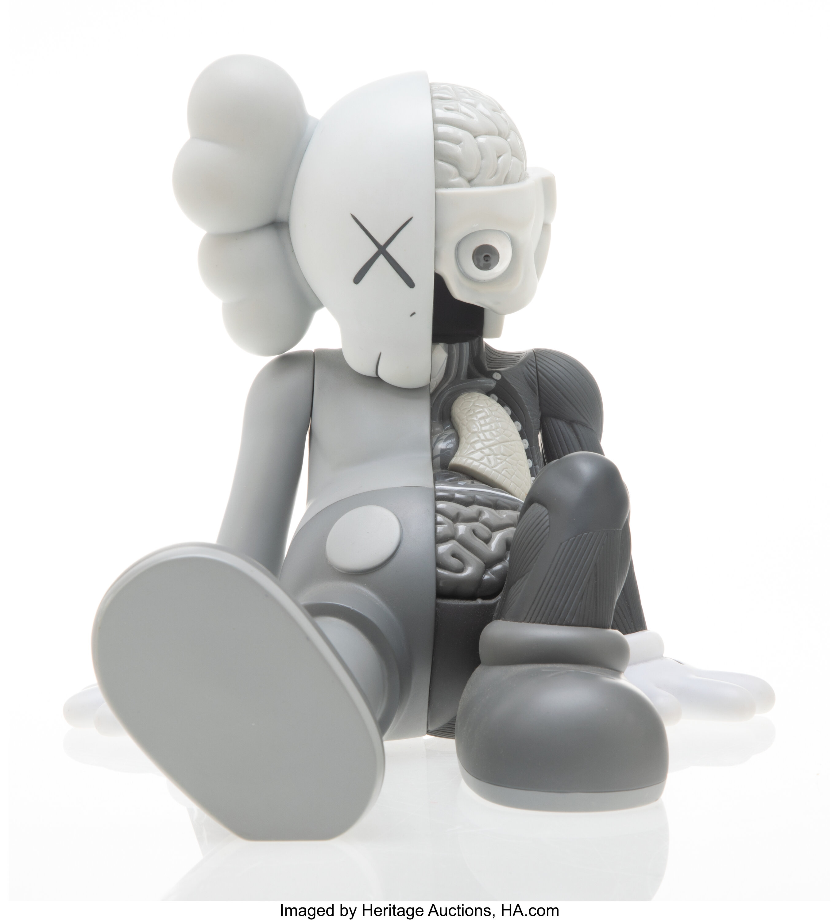 KAWS (b. 1974). Resting Place Companion (Grey), 2013. Painted cast ...