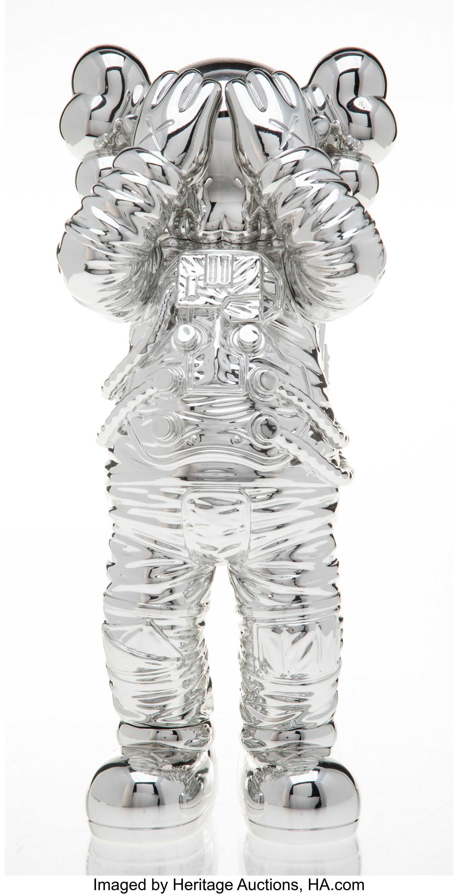 KAWS (b. 1974). Holiday: Space (Silver), 2020. Painted cast vinyl ...