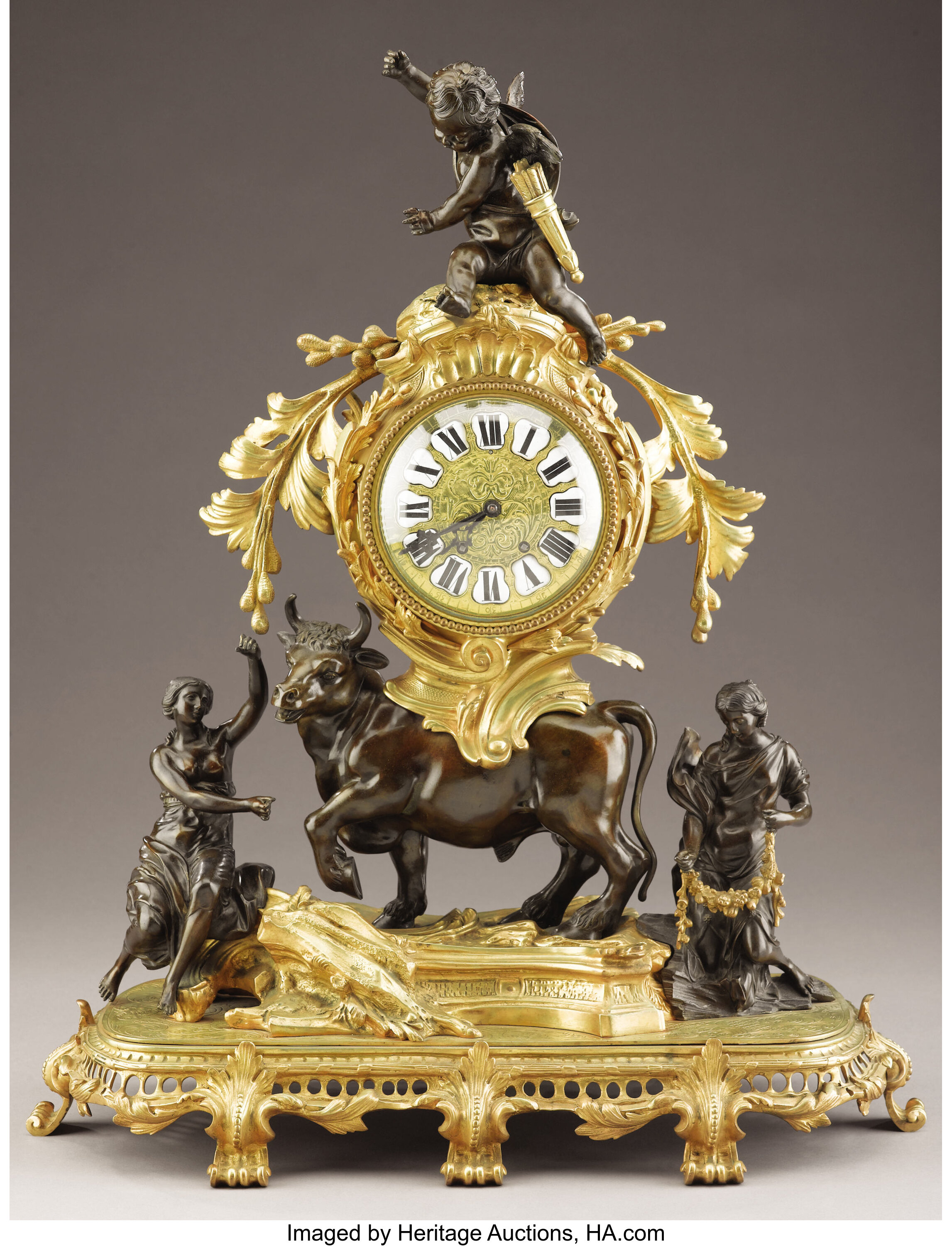 A FRENCH NAPOLEON III GILT AND PATINATED BRONZE MANTEL CLOCK. Circa ...
