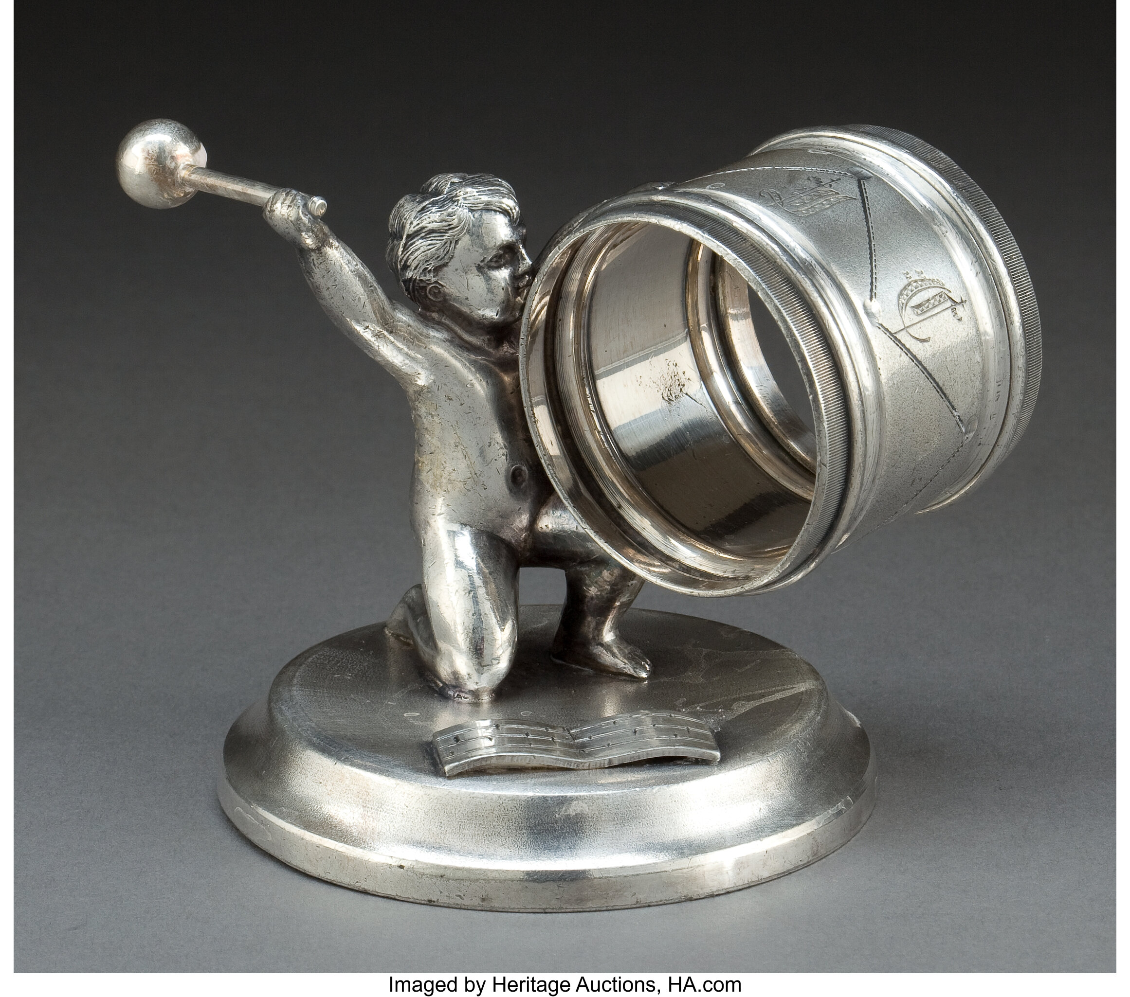 A MERIDEN SILVER-PLATED FIGURAL NAPKIN RING . Meriden Silver Plate ...