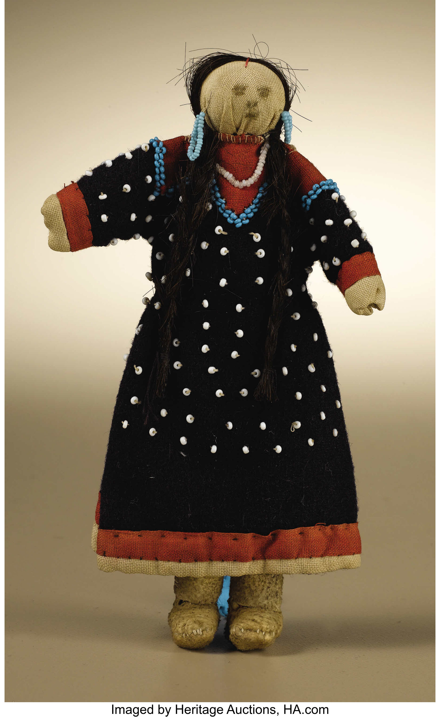 Crow Female Doll. Circa 1890. Height 6 1/4 in.. The doll is wearing ...