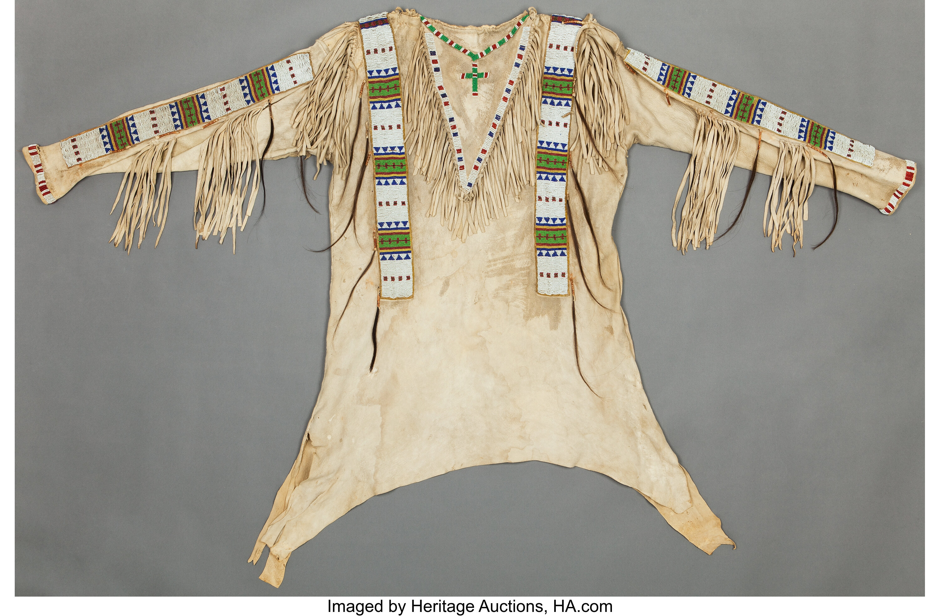 A SIOUX BEADED HIDE WAR SHIRT. c. 1900... Paintings | Lot #50163 ...